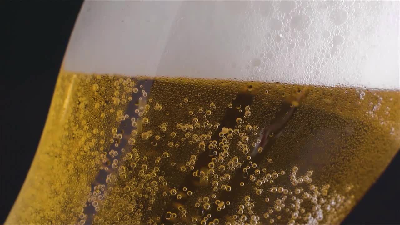 Beer Draining From Glass - Stock Video | Motion Array
