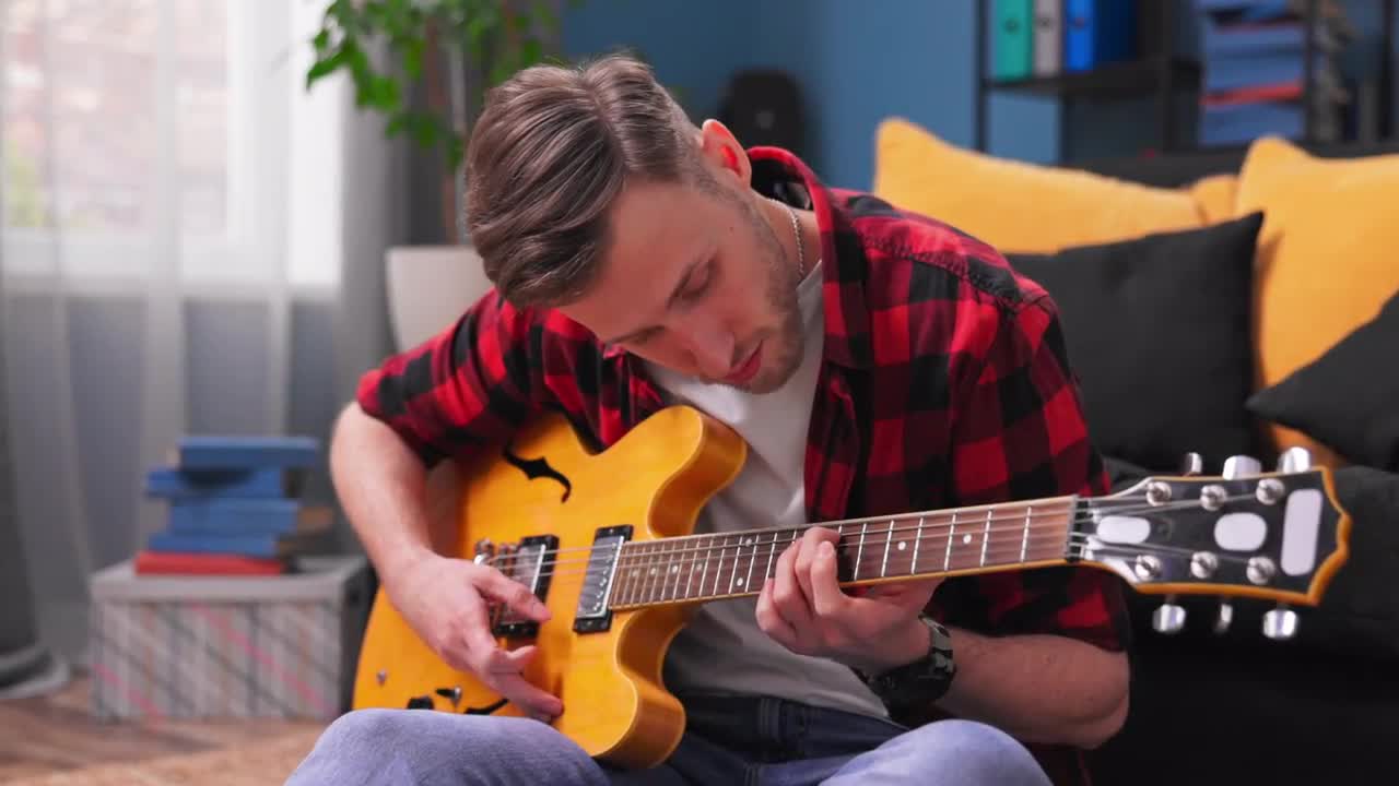 College Student Playing Electric Guitar - Stock Video | Motion Array